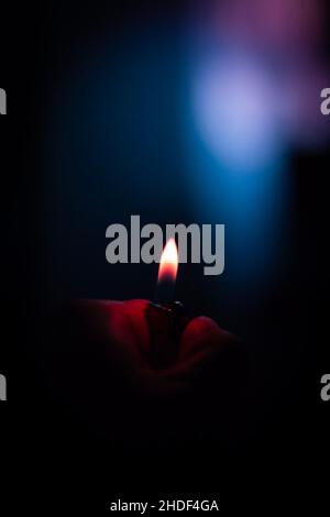 Closeup shot of smoke in the darkness with purple and red lighting ...