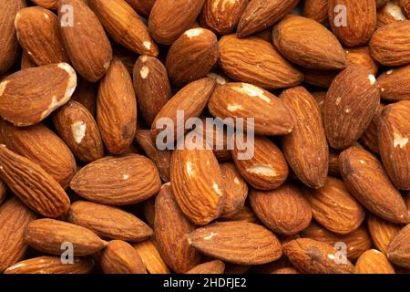 Almonds background. Full frame shot of almonds for sale in market. Copy ...