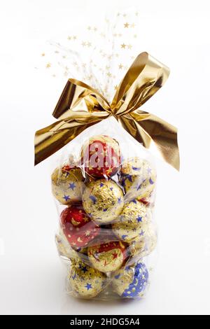 Packed gift chocolate. Packed chocolates on gray background. close up ...