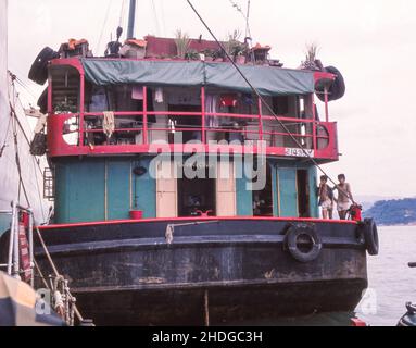 The stern of a Hong Kongese or Chinese barge flying the red ensign ...