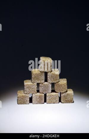 Pyramid of cane sugar cubes isolated on white background Stock Photo ...