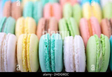 Background of colored sweet macaroons with bokeh Stock Photo - Alamy