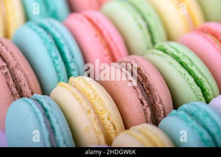 Background of colored sweet macaroons with bokeh Stock Photo - Alamy