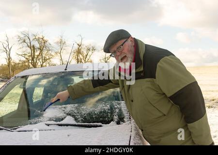 man, scraping ice, guy, men, scraping ices Stock Photo - Alamy