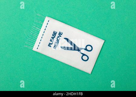 please remove, clothing label Stock Photo - Alamy