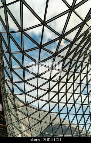 Vertical shot of the building with triangular roof on the street ...