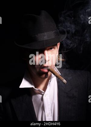 Man with cigars in his mouth Stock Photo - Alamy