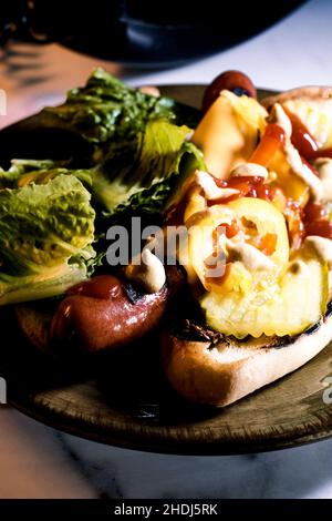 The works hot dog with retro landline corded phone in the background ...