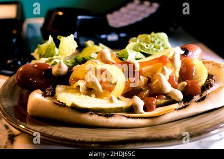 The works hot dog with retro landline corded phone in the background ...