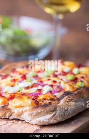 Studio shot of Tarte Flambee or Flame Cake cut out against a white ...