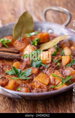 Stifado - a traditional Greek stew with rabbit meat and pearl onions ...