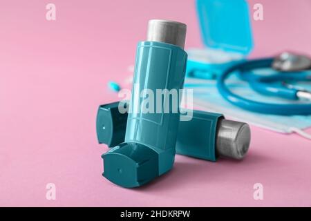 Inhalers on pink background, closeup. Asthma treatment Stock Photo - Alamy