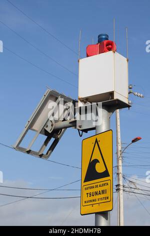 Warning sign with tsunami symbol Stock Photo - Alamy