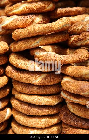 Traditional Turkish simit. Stacked turkish pastries as background ...