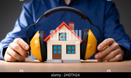 House Loud Noise Protection. Construction Sound Protection Stock Photo ...