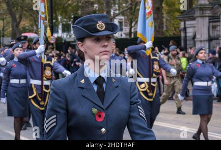 Female officer cadets march in line with their weapons on shoulders ...