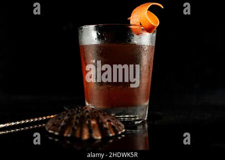 A high-end craft cocktail isolated on a black background Stock Photo ...