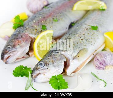 Fresh trout fish with spices on wooden background Stock Photo - Alamy