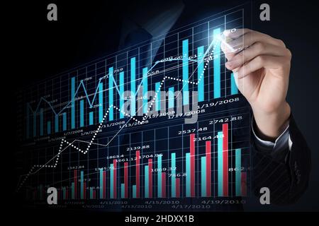 stock exchange statistics drawing in note pad and business elements on ...
