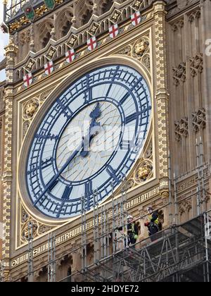 Construction Workers remove scaffolding from the clock face of ...