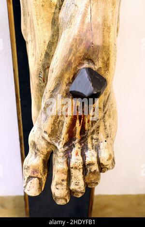 Close up of the crucified feet of Jesus Christ on marble statue with a white background Stock ...