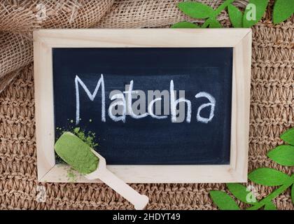 Matcha written on black chalkboard with rustic background Stock Photo ...