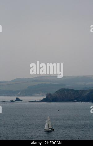 Vertical shot of the sea surrounded by cliffs in the evening Stock ...