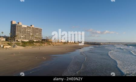 Condominium high rise along bluff on Pacific Beach, Crystal Pier in ...