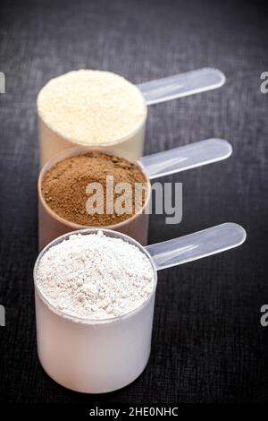 measuring spoon with casein and creatine, powdered food supplements ...
