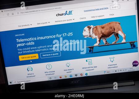 Churchill Insurance Company website on a laptop computer, UK, with ...