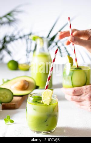 two glasses of Vegan detox green smoothie on a white table Stock Photo ...