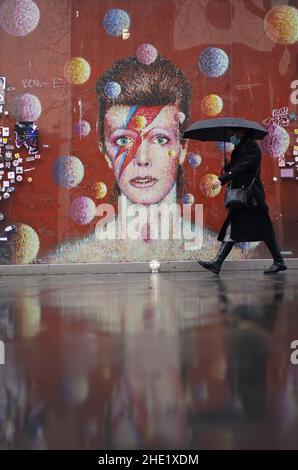 A candle tribute is placed at the David Bowie mural in Brixton, south ...