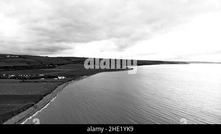 Aerial image overlooking Llanon coast showing the sea, coastal path ...