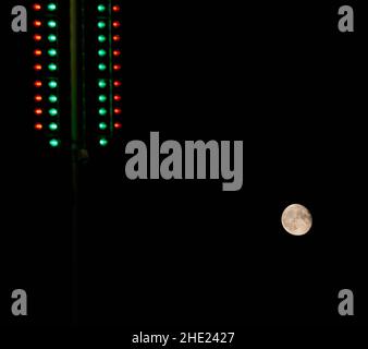 Full moon of August seen against artificial lamps Stock Photo - Alamy