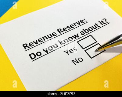 One person is answering question about revenue reserve Stock Photo - Alamy