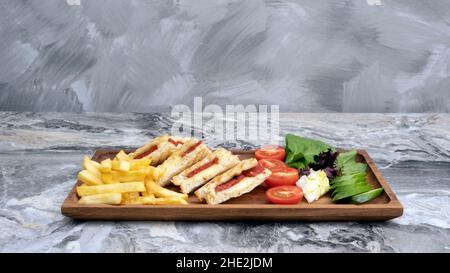 toast in wooden serving platter on marble background Stock Photo - Alamy