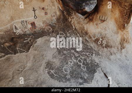 Rock texture with old pictograms - ancient historical wall Stock Photo ...