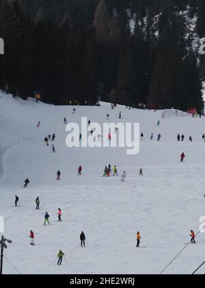 many skiers skiing in dolomites gardena valley snowy mountains Stock ...
