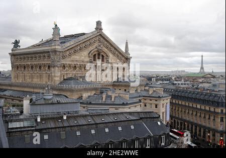 The Palais Garnier opera house and the Eiffel Tower at night in Paris ...