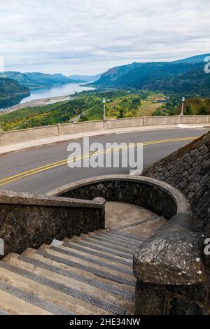 Scenic view of quiet transparent river with spots of white snow on the ...