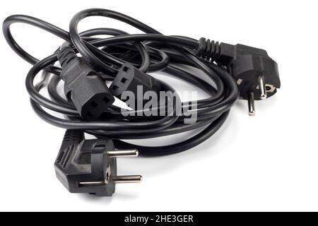 Pile of computers power cables with plug isolated on white background ...