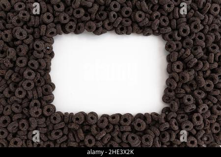 black cereal rings in form of frame with space for text, delicious ...