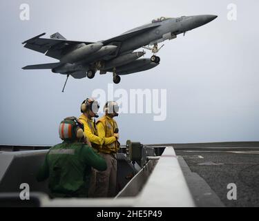 Sailors aboard USS Nimitz (CVN 68) conduct a SLQ-25/25A Nixie towed ...