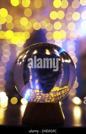 Crystal Ball on the floor with bokeh. Glass ball with colorful bokeh ...