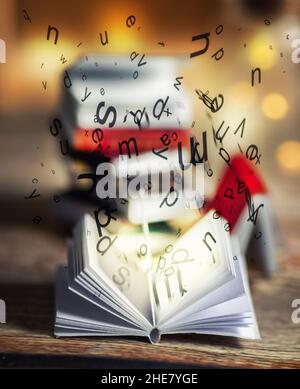 Open book with letters flying out of it on white background Stock Photo - Alamy