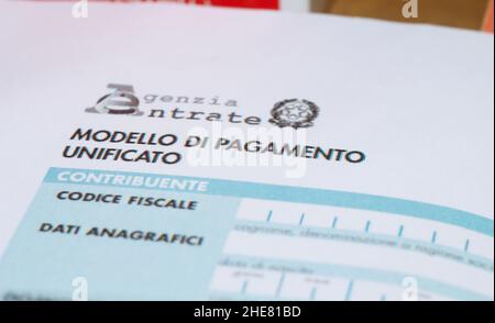 F24 for the tax return in Italy with magnifying glass Stock Photo - Alamy
