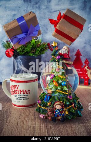 Beautiful Christmas gift boxes on floor near fir tree in room Stock ...