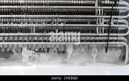 The drainage plug on a non-frost freezer is blocked with ice, having to ...