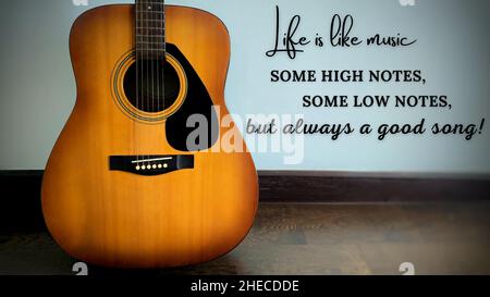 Inspirational quotes with guitar background Stock Photo - Alamy