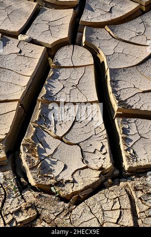 Earth cracked in times of drought and extreme heat. France Stock Photo ...